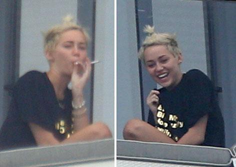 Miley Cyrus Goes Into Fits Of Giggles Smoking Suspicious-Looking Cigarette