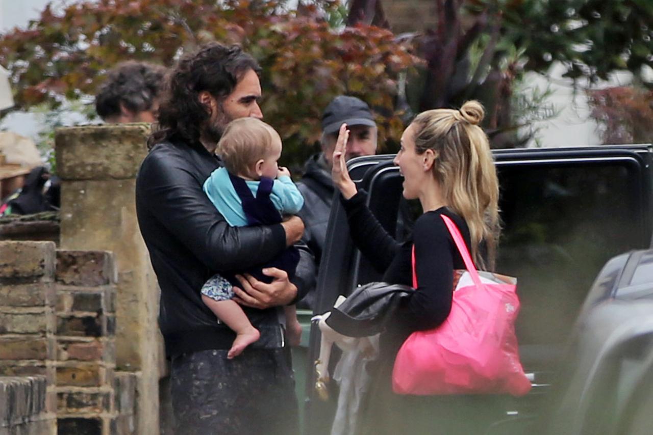 Russell Brand Shows Off His Sweet Side, Cradles Baby Girl During Family ...