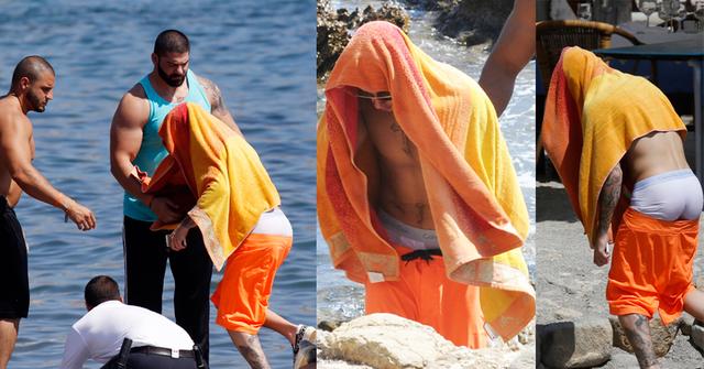 Embarrassed, Justin? Bieber Hides His Head— And Bares His Butt— As He ...