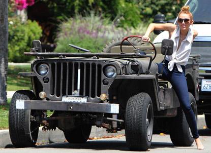 Barefoot Miley Enjoys A Ride in Neighbors' Classic Car