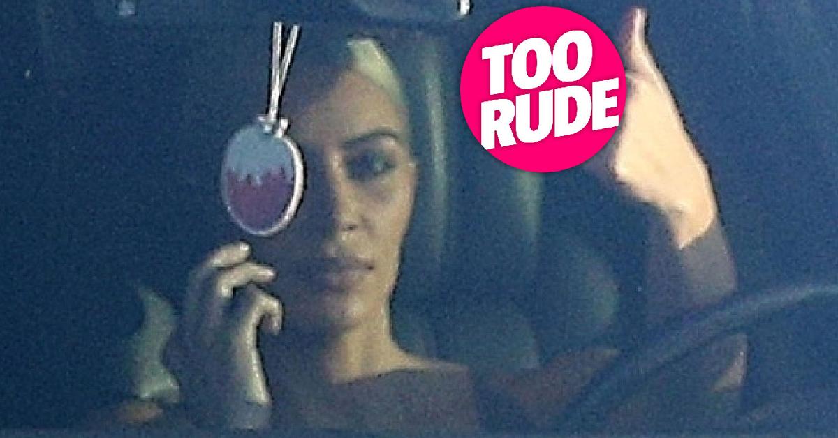 Kim Kardashian Flips Off Paps