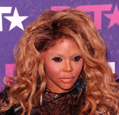 What's Up With Your Face Lil' Kim....?