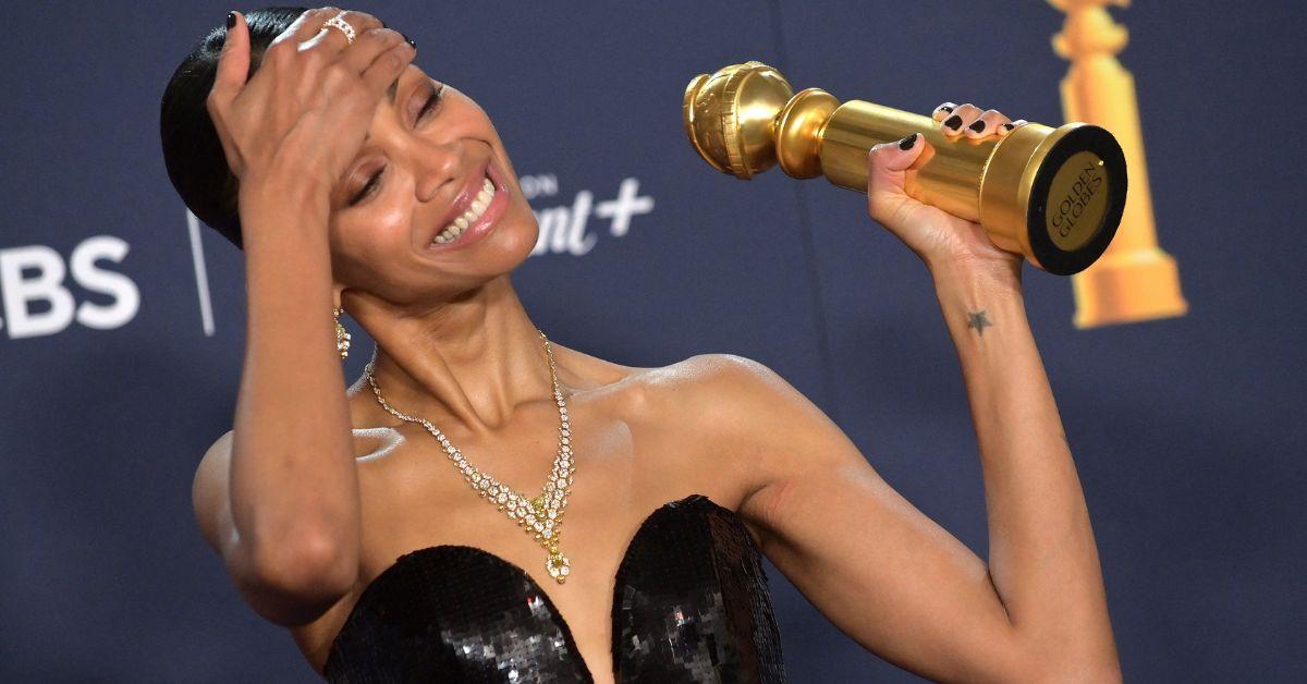 Zoe Saldana Slammed For Crashing Golden Globes Stage For Best Song Gong