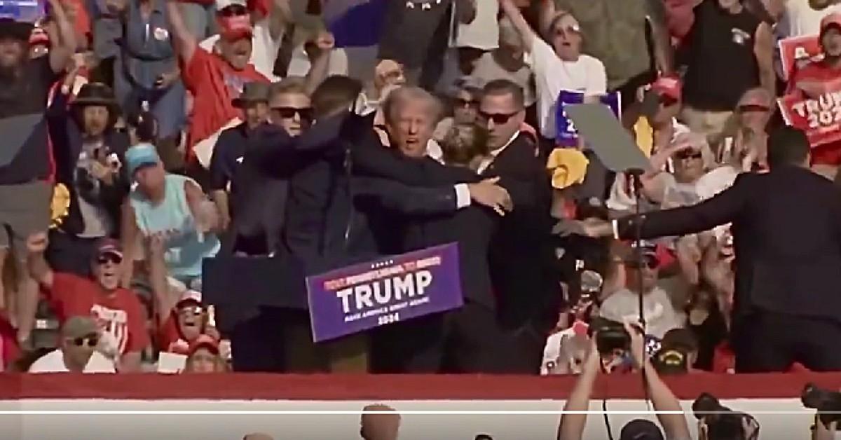 Donald Trump Stands and Raises his Fist in Defiance After Multiple ...
