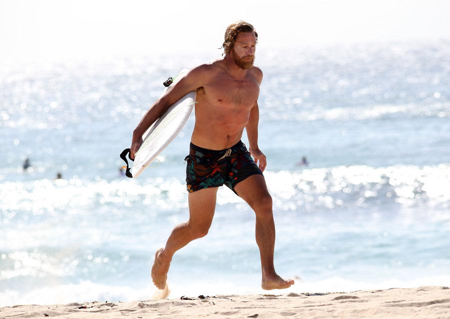 Shirtless Simon Baker Sports Scruffy Beard On Surfing Excursion