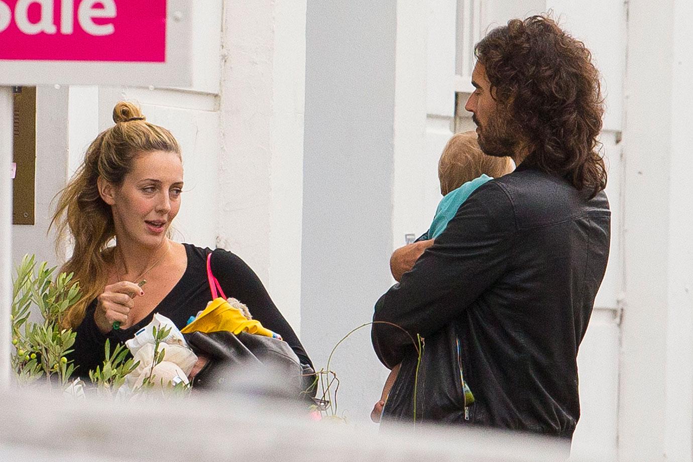 Russell Brand Shows Off His Sweet Side, Cradles Baby Girl During Family ...
