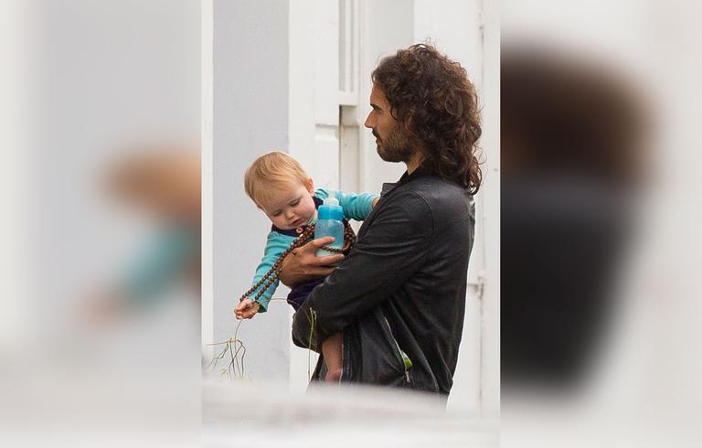 Russell Brand Shows Off His Sweet Side, Cradles Baby Girl During Family ...