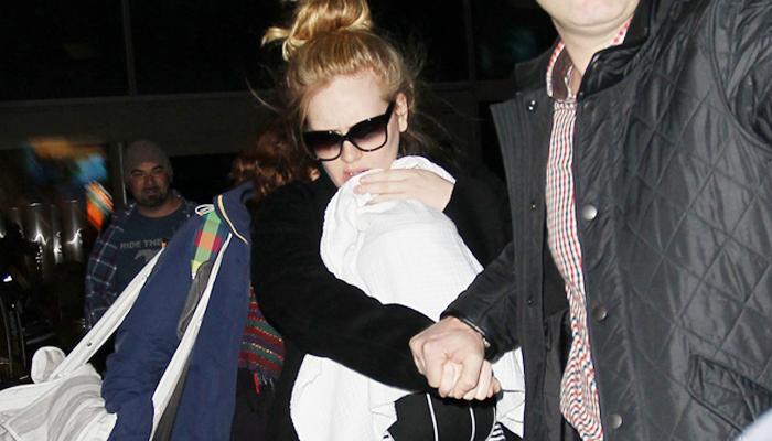 Adele Is One Protective Mum! She Covers Up Baby Son As She Arrives For ...