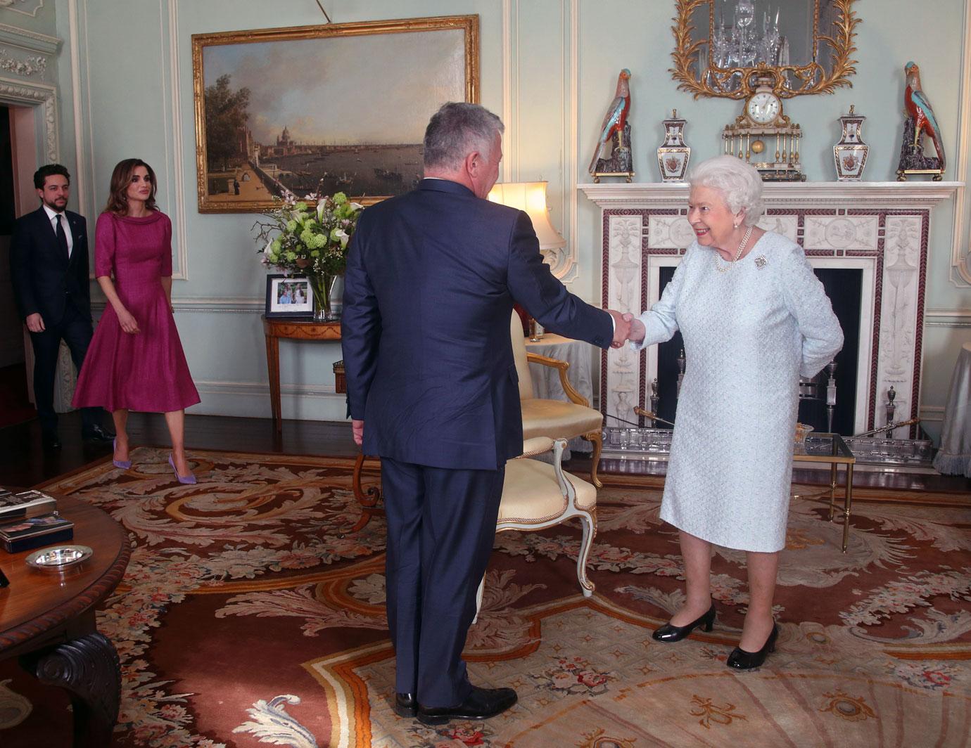 Queen Elizabeth Shows Off Bruised, Purple Hand In Scary New Photos