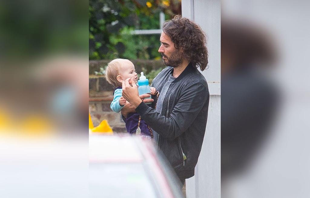 Russell Brand Shows Off His Sweet Side, Cradles Baby Girl During Family ...