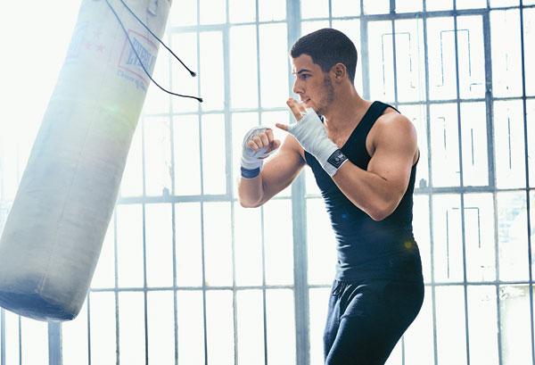 Sexy! Nick Jonas Lifts His Shirt And Reveals Taut Abs In 'Men's Fitness'