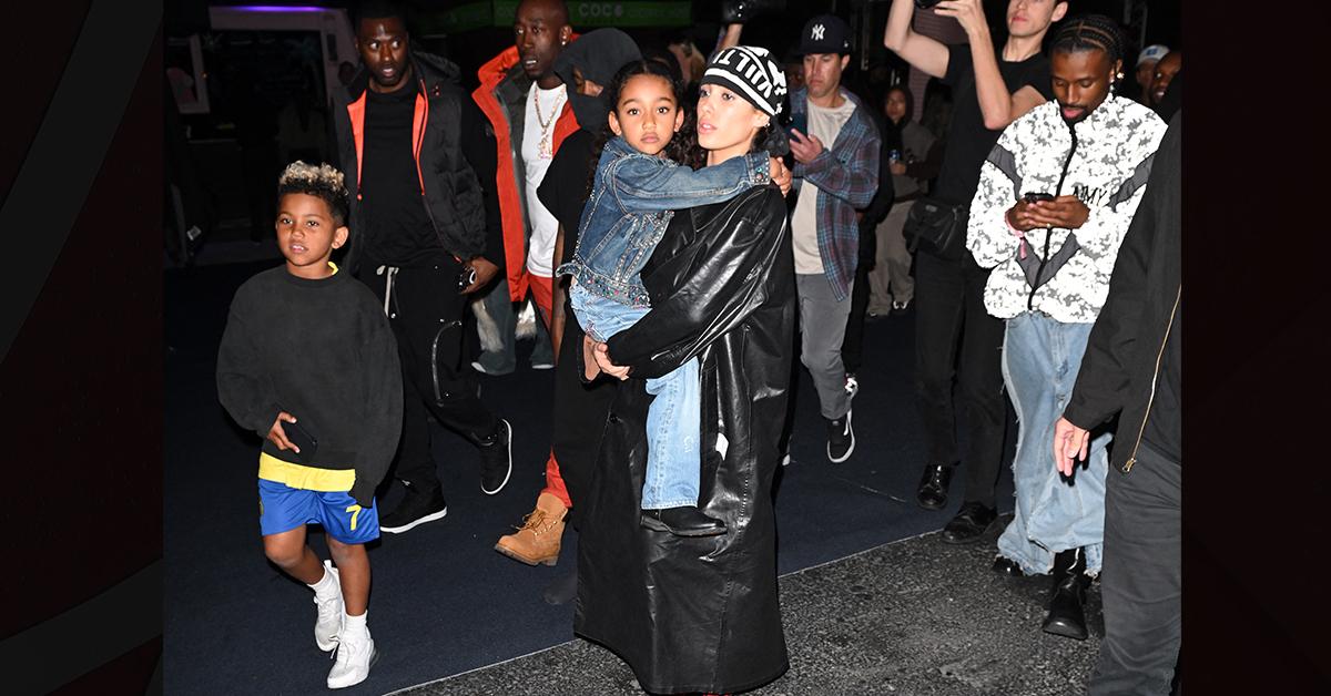Kanye West's Wife Cradles Chicago, 5, After Rapper Wears KKK-Style Hood