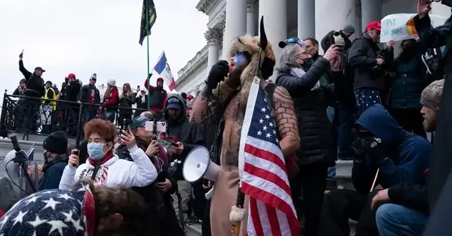 'QAnon Shaman' Files $40 Trillion Lawsuit Against Donald Trump