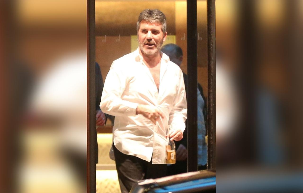 Simon Cowell Seen Drinking, Smoking Cigarette After Hospital Visit