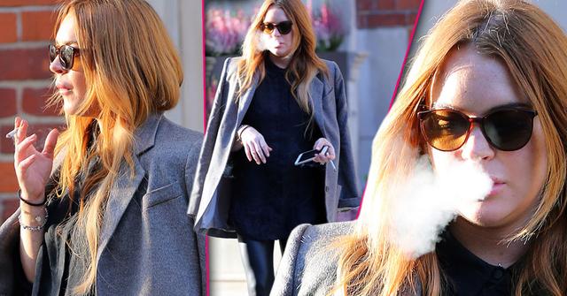 Lindsay Lohan Takes Smoking Break Outside Of London Hotel