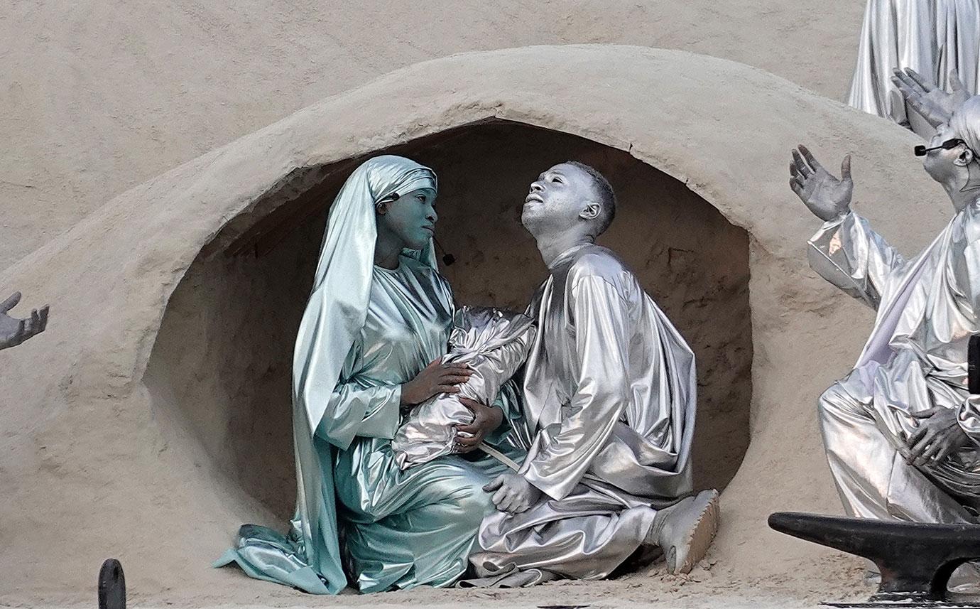 Kanye West Wears Silver Body Paint & Robe For Miami Opera