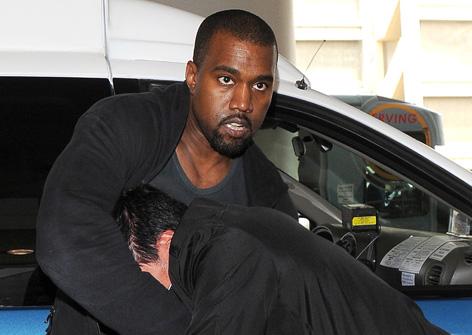 He's At It Again! Kanye West Goes Berserk On Photog At LAX