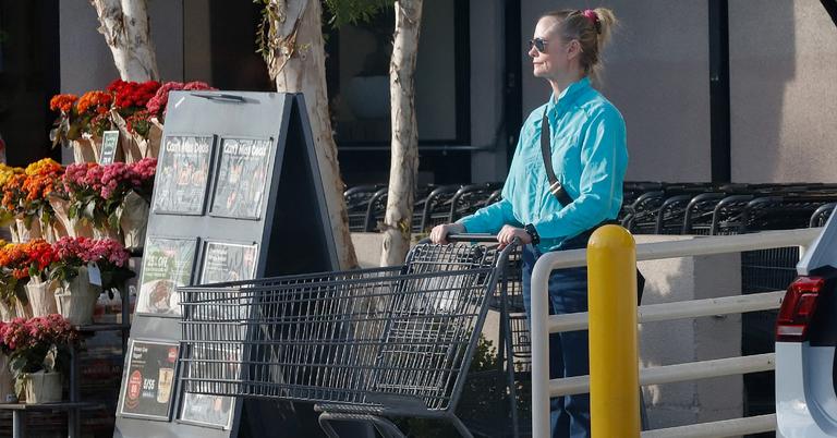 Hollywood Legend Leans on Assistant for Help During Rare Outing