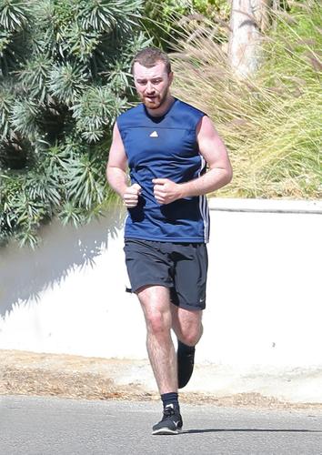 Scary Skinny Sam Smith Clutches Chest While Out For A Run