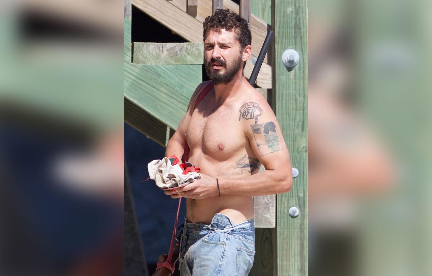 Shia LaBeouf Carries Massive Shotgun & Shows Off Muscles At Beach
