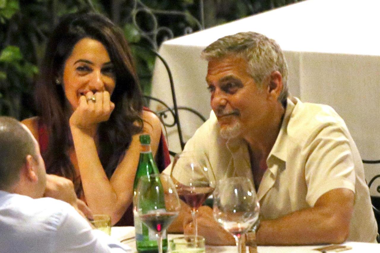 Amal & George Share Kiss During Romantic Italian Dinner