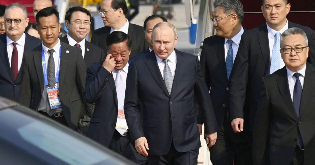 Vladimir Putin Spotted With Nuclear Briefcase During Visit to China